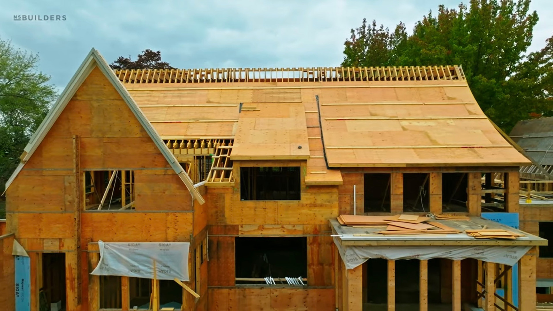 Blog | NS Builders | Crafted With Intention | Sheathing the Swooping Roof