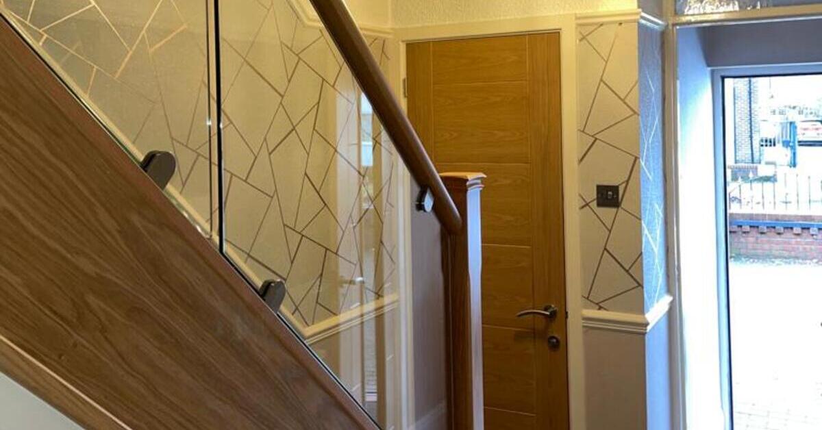 Solid Oak Staircase Renovation With Curtail Feature Step | The Stair Shop