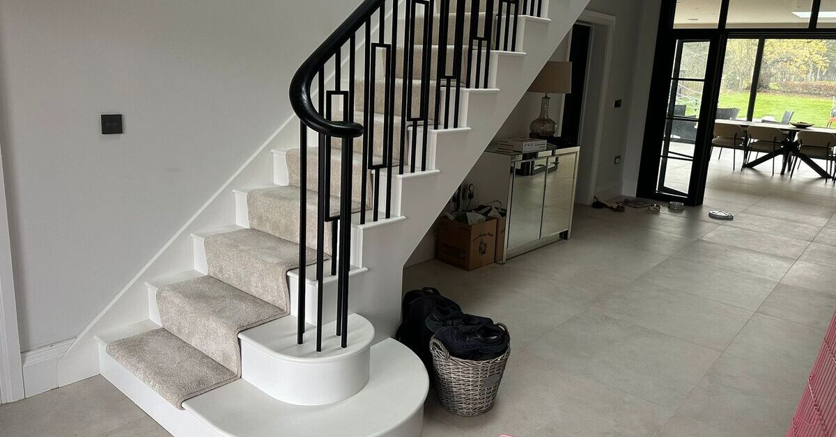 Statement White Cut Stringer Staircase With Black Iron Detailing | The ...