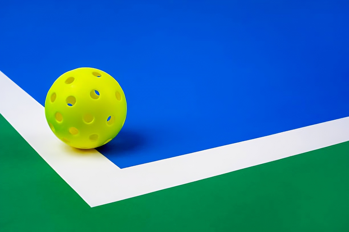 The Fascinating Reason Why Pickleballs Have Holes | The Skilled Pickle